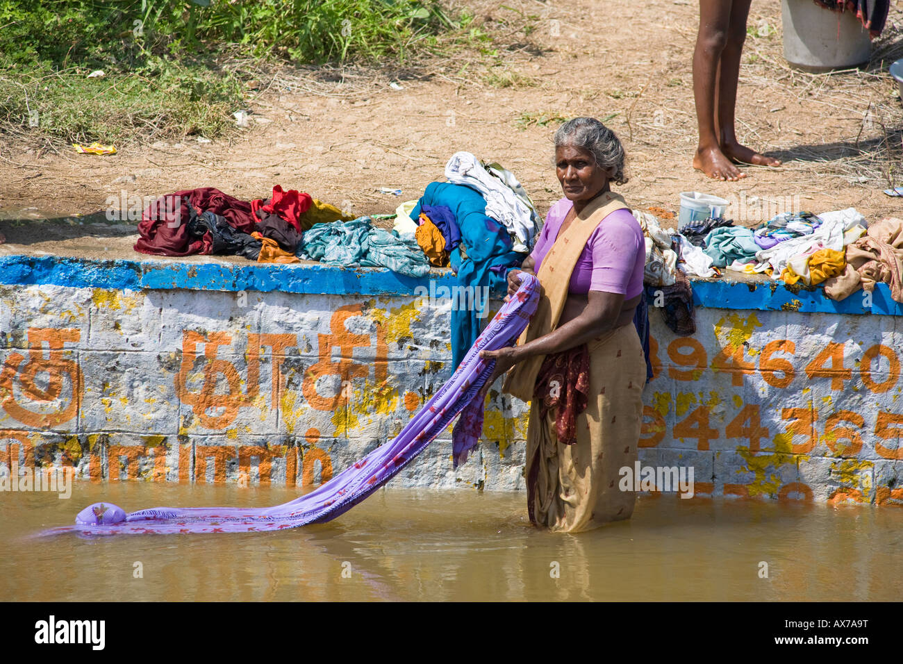 Lady washing clothes hi-res stock photography and images - Alamy