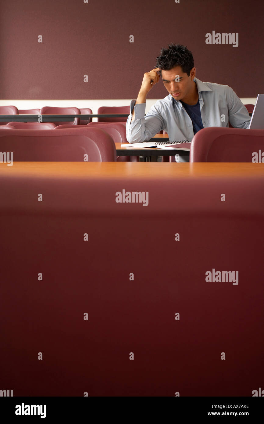 College student sitting in a lecture hall and studying Stock Photo - Alamy