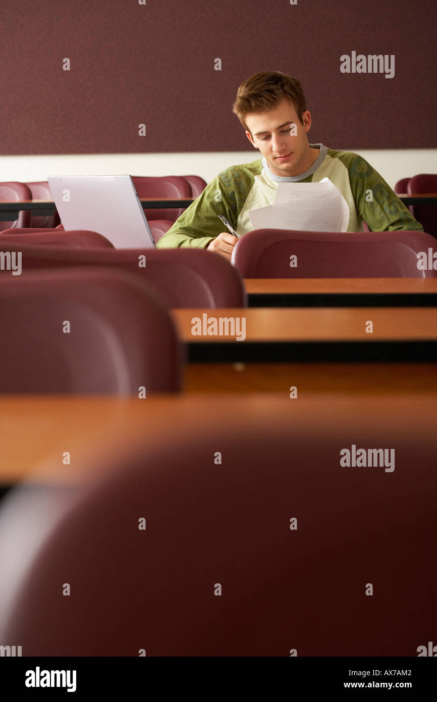 College student sitting in a lecture hall and studying Stock Photo - Alamy
