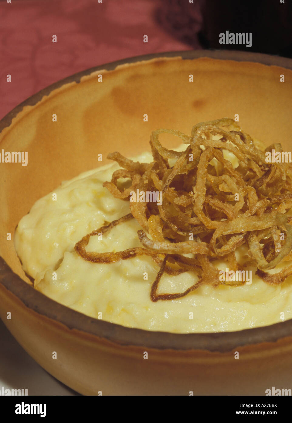 mashed potatoes with roasted onion rings as garnish Stock Photo - Alamy