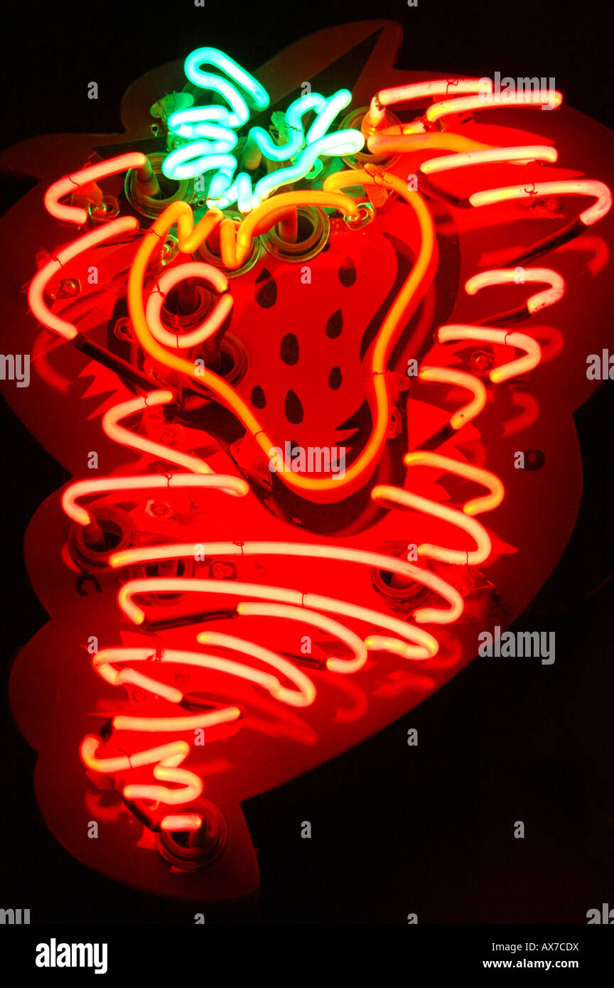 A neon sign depicting a vibrant strawberry Stock Photo - Alamy