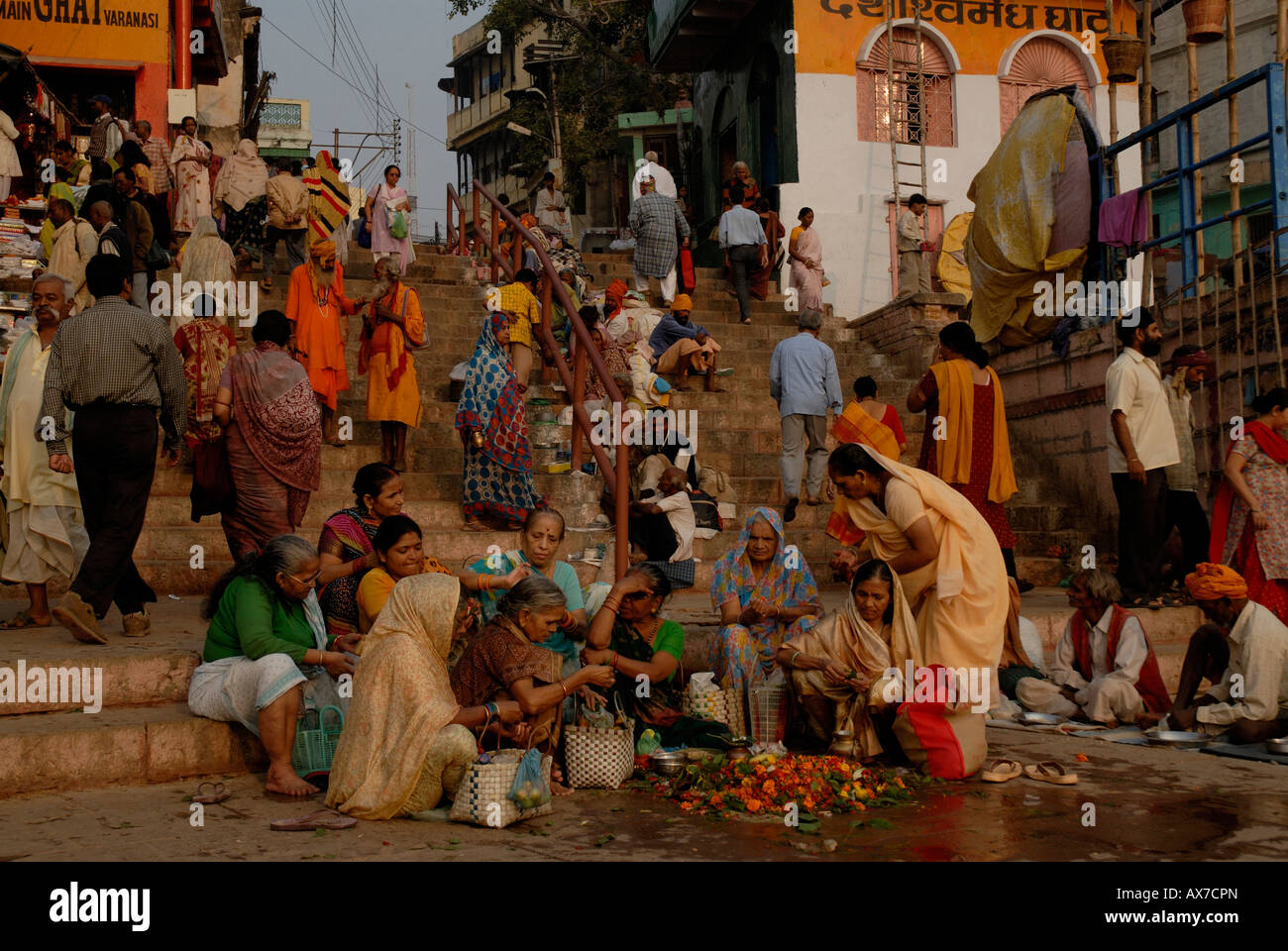 Crowd of Hindu people near Scindia Ghat preparing to enter the Holy ...