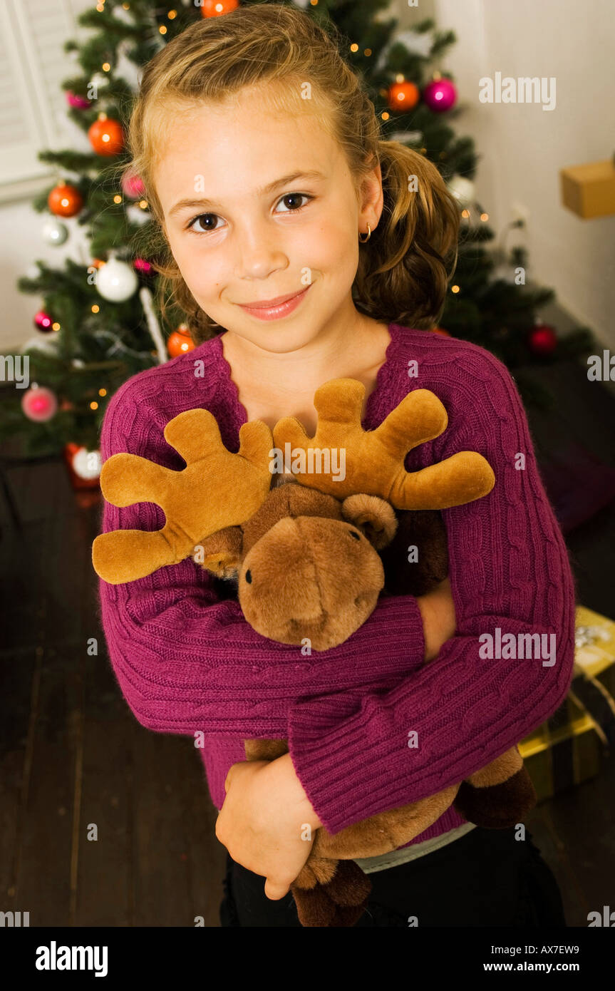 Portrait of a girl hugging a stuffed toy Stock Photo - Alamy