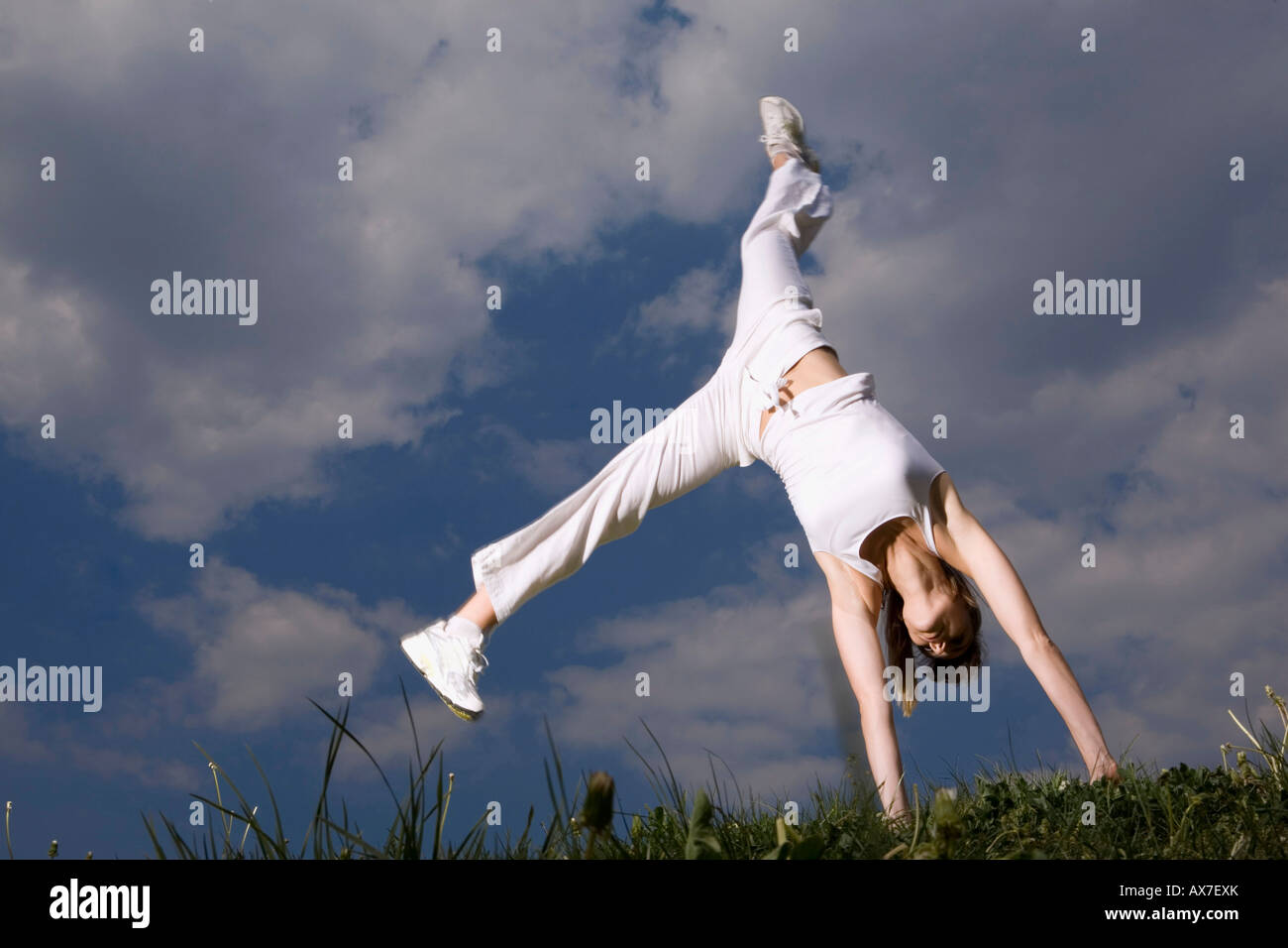 Young woman doing headstand Stock Photo - Alamy