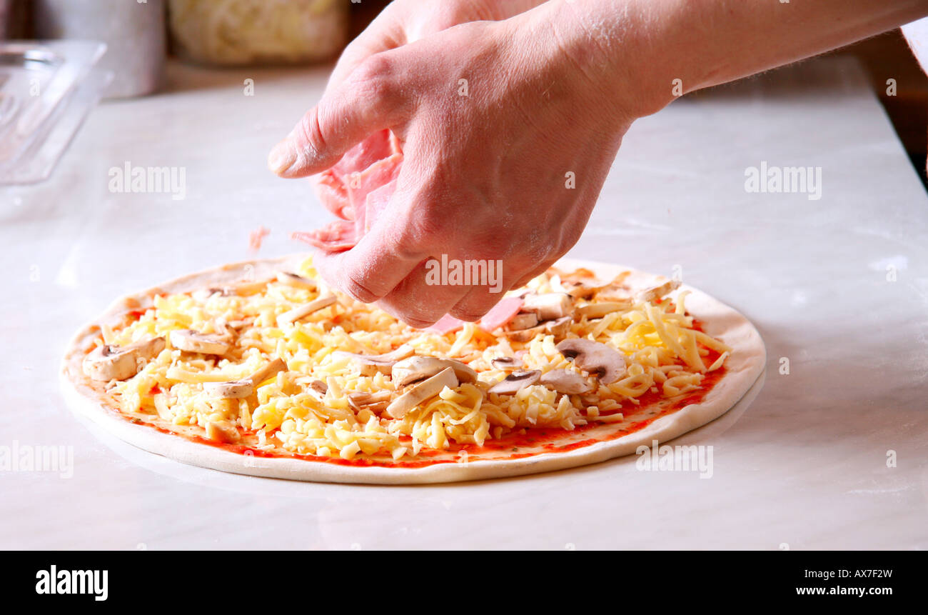 Making an italian pizza Stock Photo - Alamy