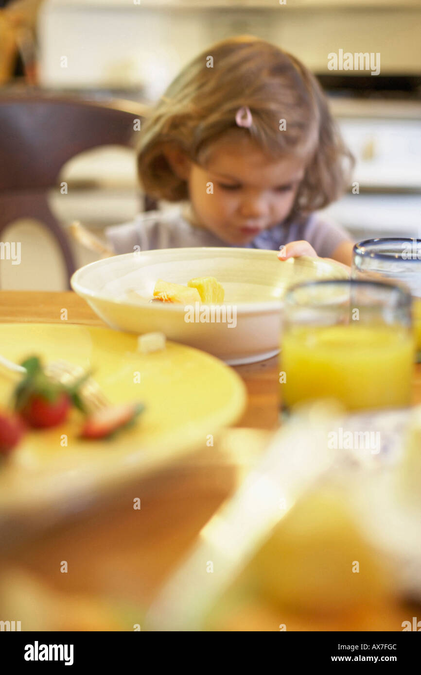 Girl sitting in front table hi-res stock photography and images - Alamy