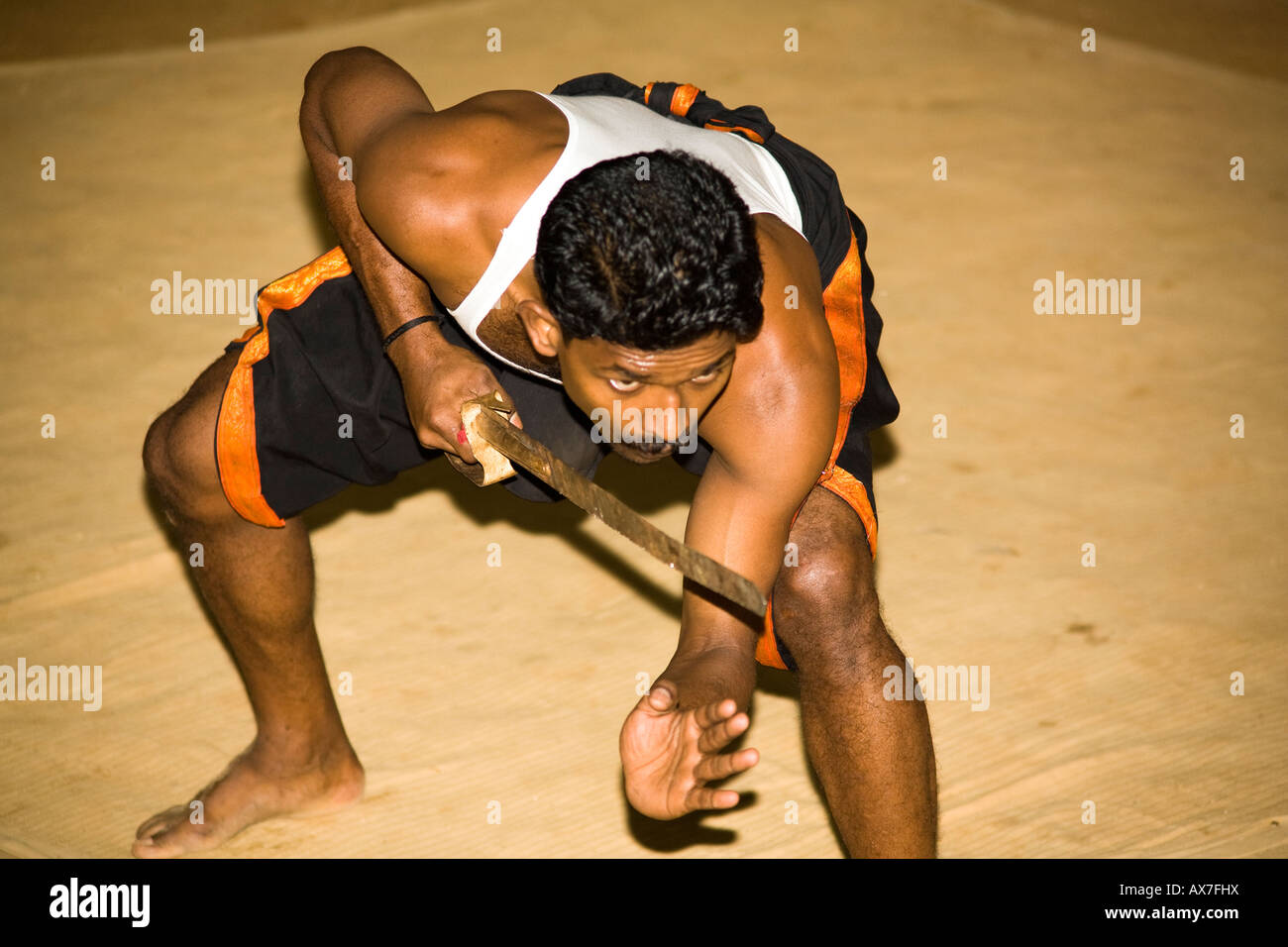 Kalarippayattu martial arts performer, during performance, Kerala ...