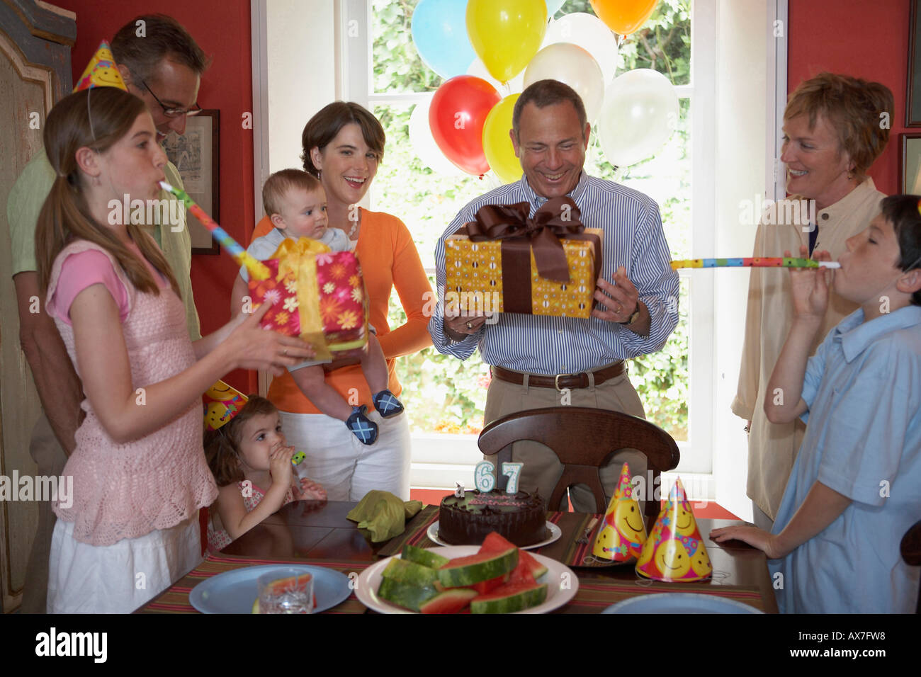 Family at a birthday party Stock Photo - Alamy