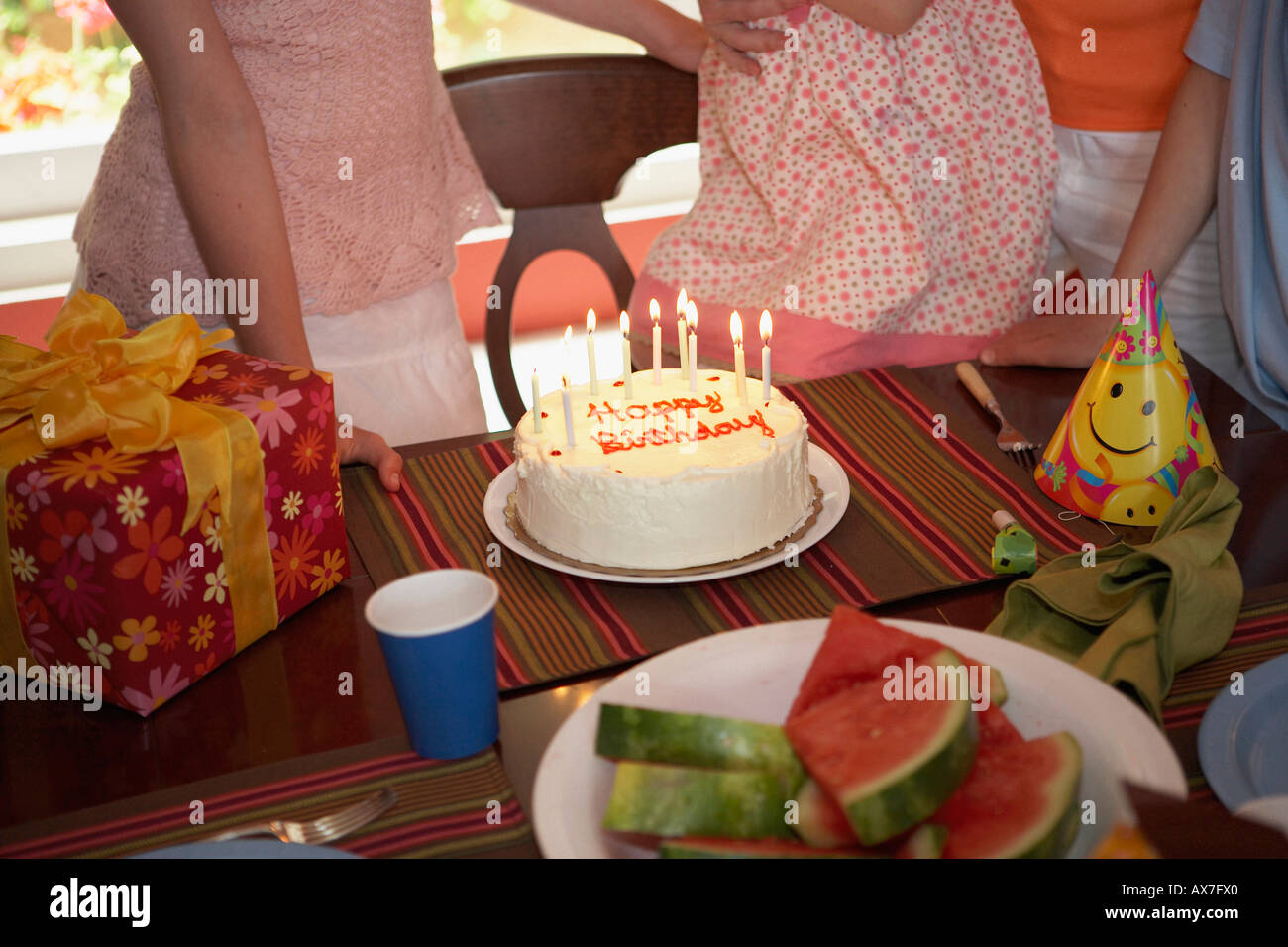 Mid section view of four people celebrating a birthday Stock Photo - Alamy