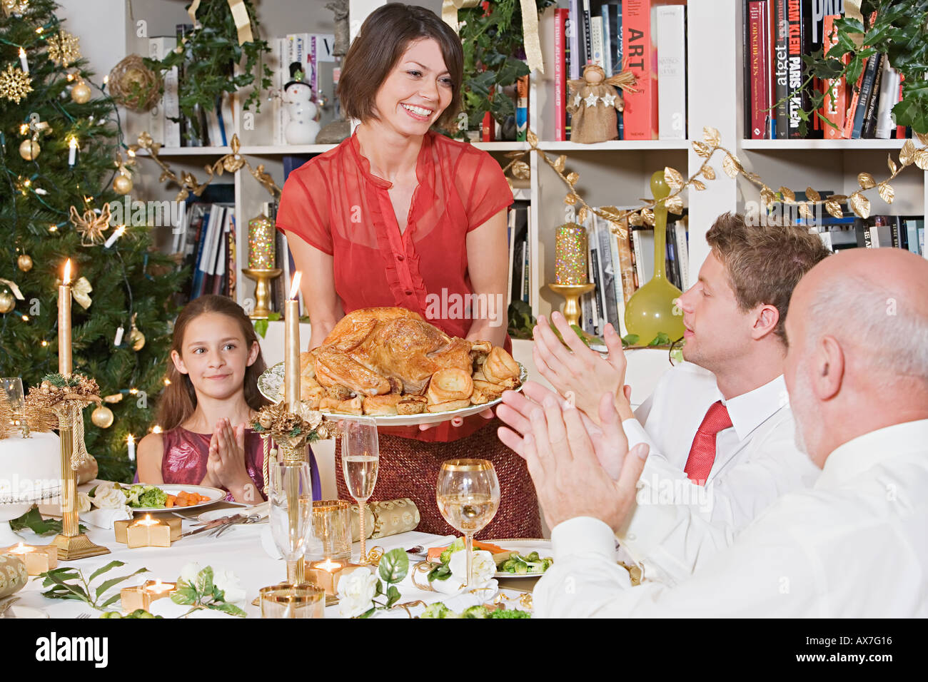 Family at dining table at christmas Stock Photo - Alamy