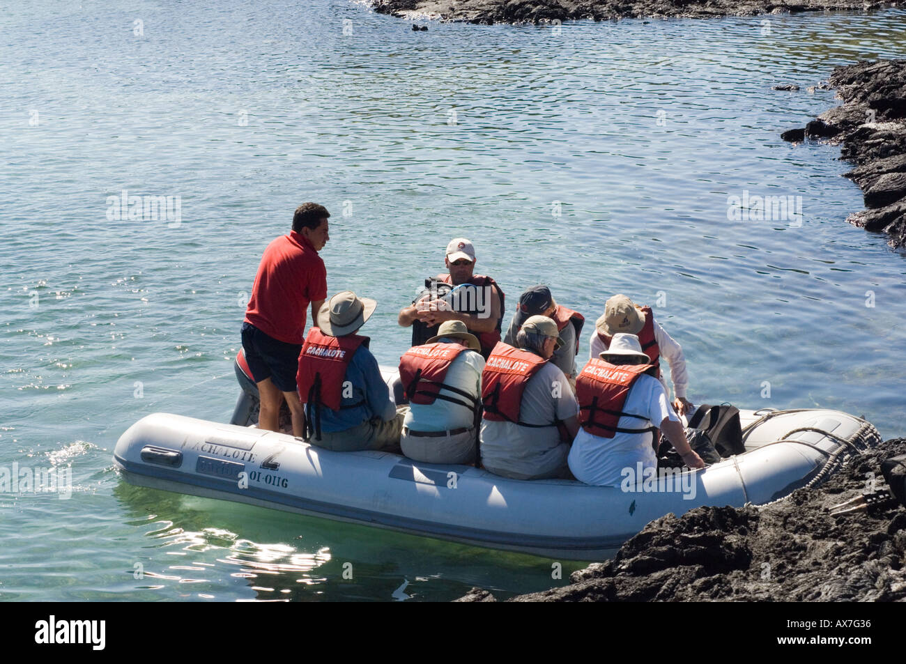 Tourists coming to land at Punta Moreno Isabela Island Galapagos ...