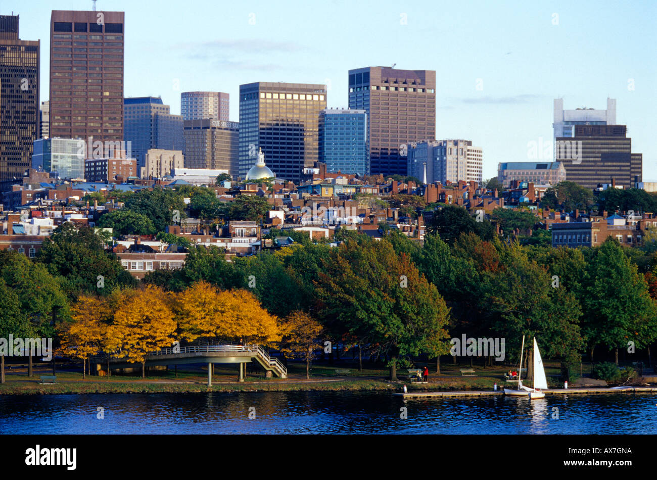 Sailing boat on Charles River in front of high rise buildings, Boston ...