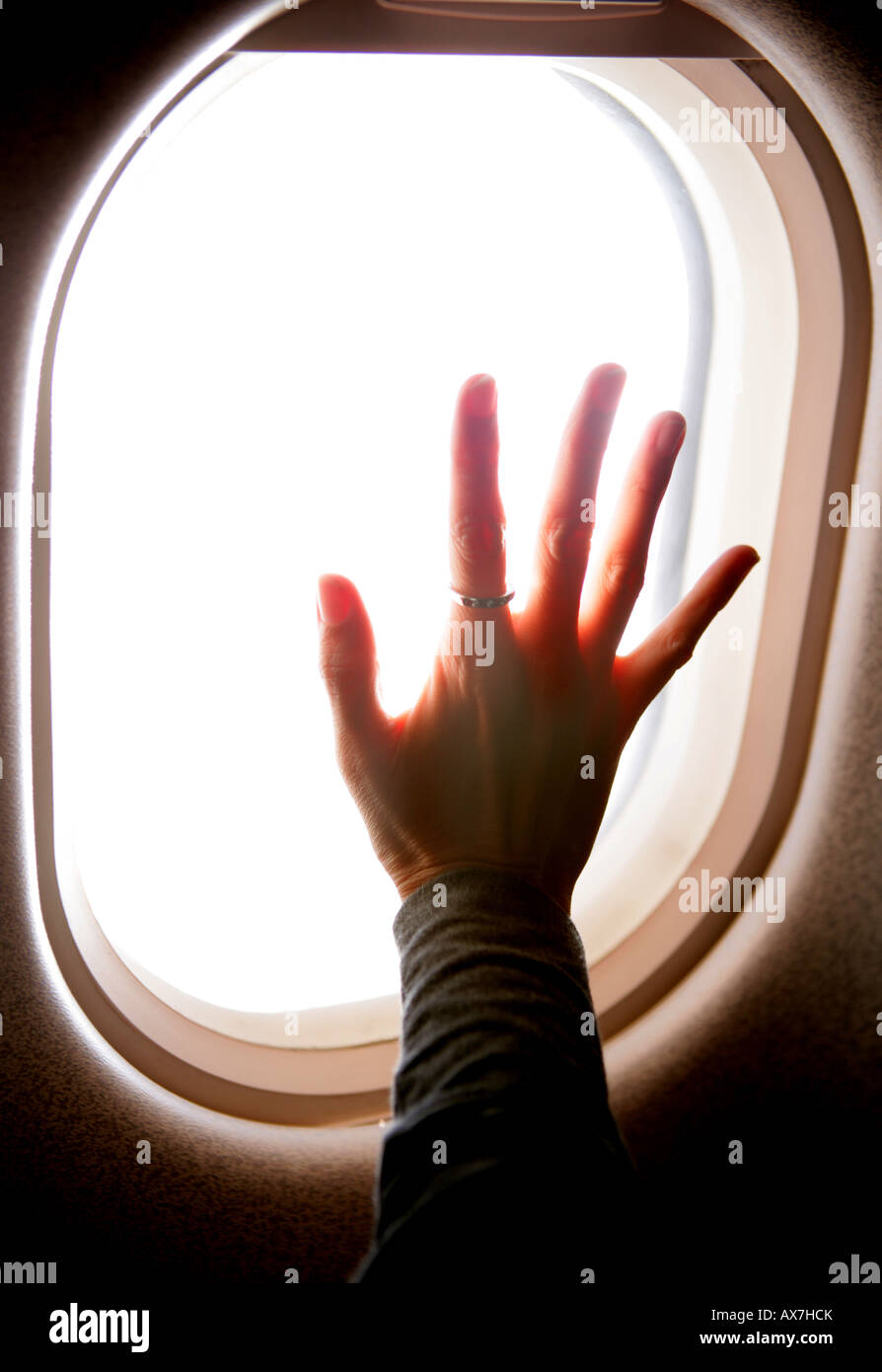 hand at the window of a plane Stock Photo - Alamy