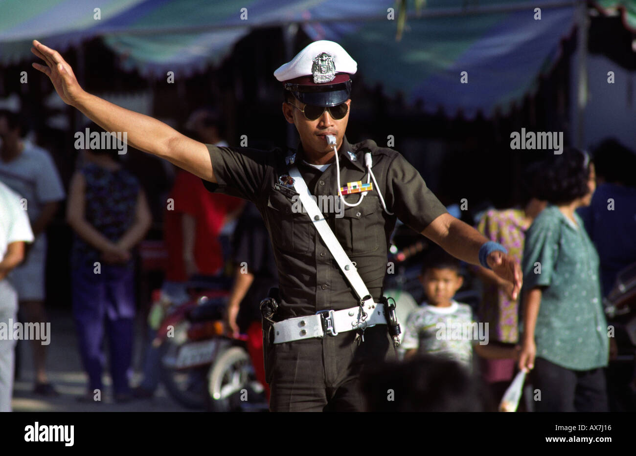 Thai traffic police waving hi-res stock photography and images - Alamy
