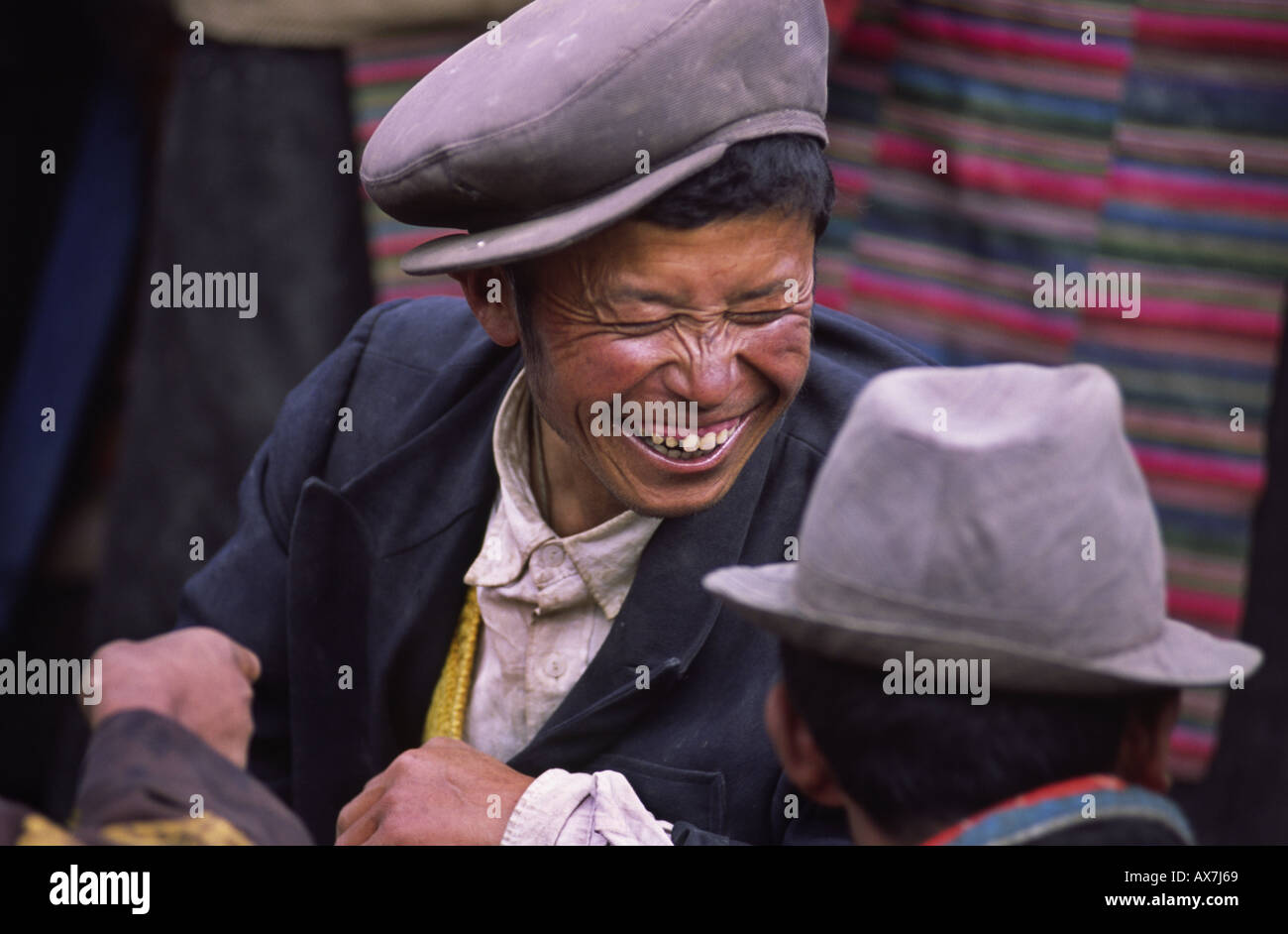 Tibetan man smiling with hat hi-res stock photography and images - Alamy