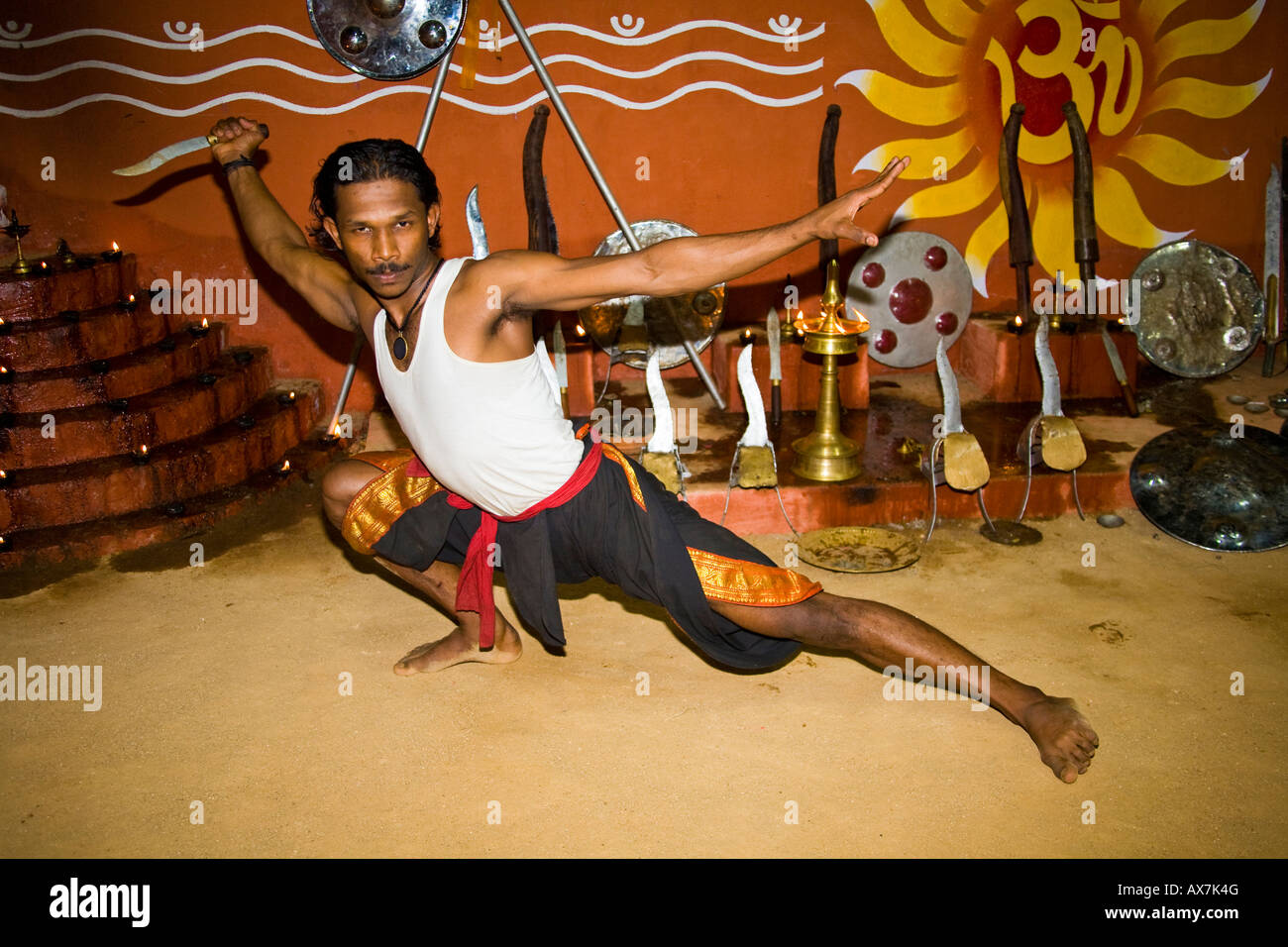 Kalarippayattu martial arts performer in attacking pose, Kerala Kalari ...