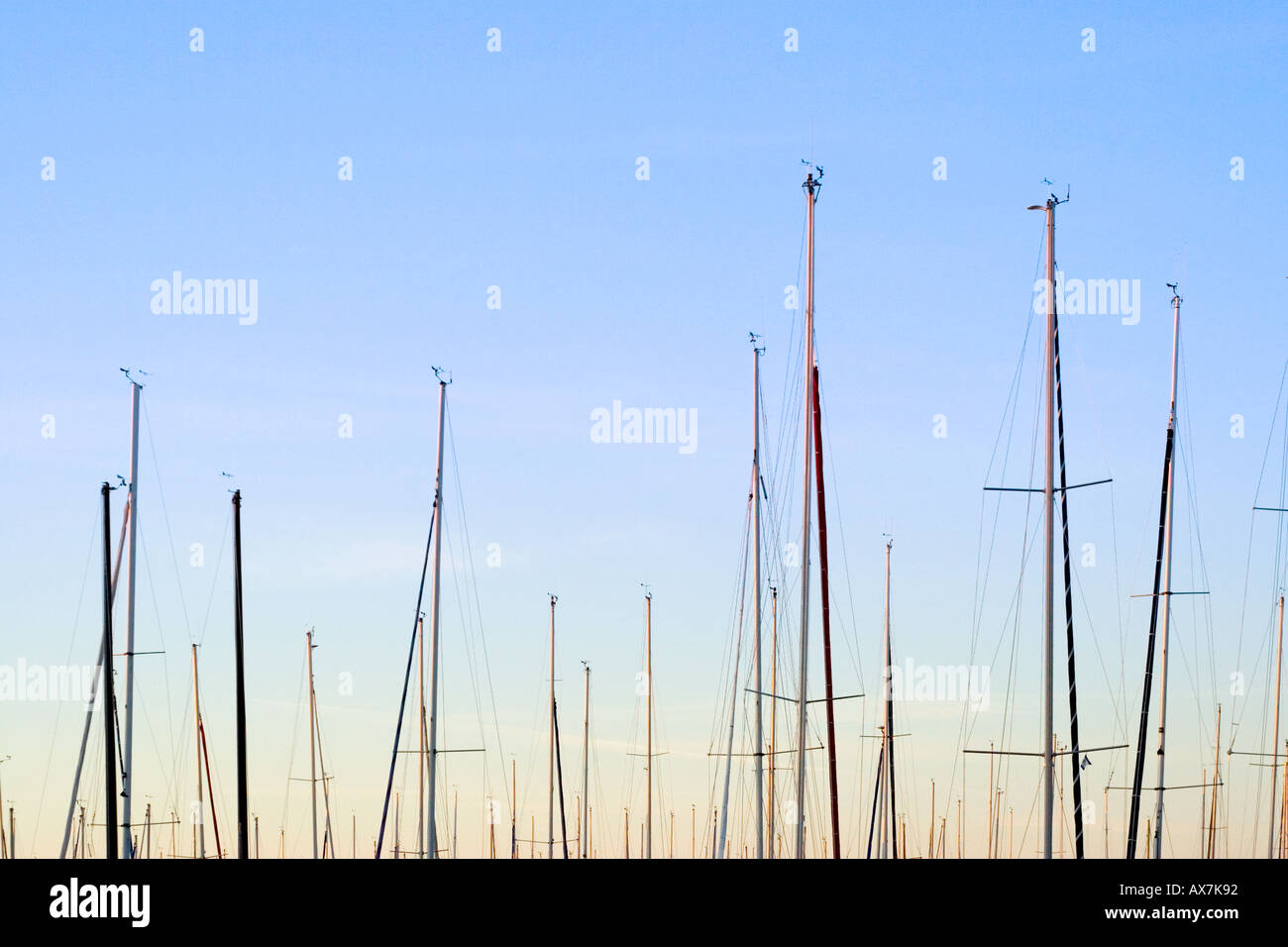 Sailboat masts on sunset sky Stock Photo - Alamy