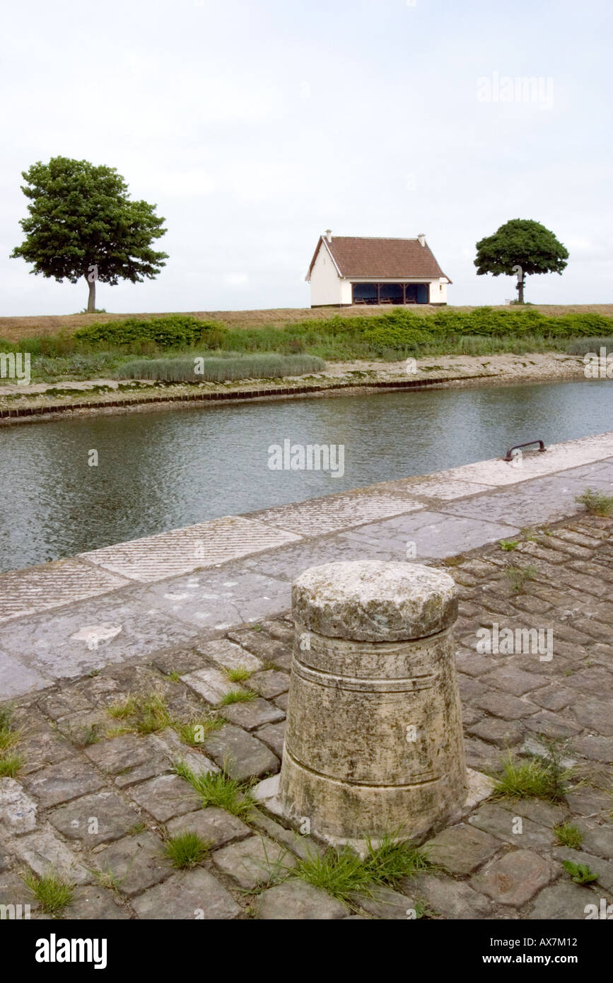 Quayside view across estuary of River Somme with capstan at St Valery ...