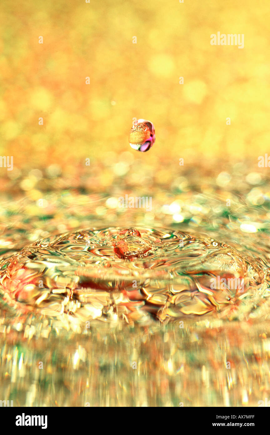 WATER DROPLET SPLASHING INTO WATER Stock Photo - Alamy
