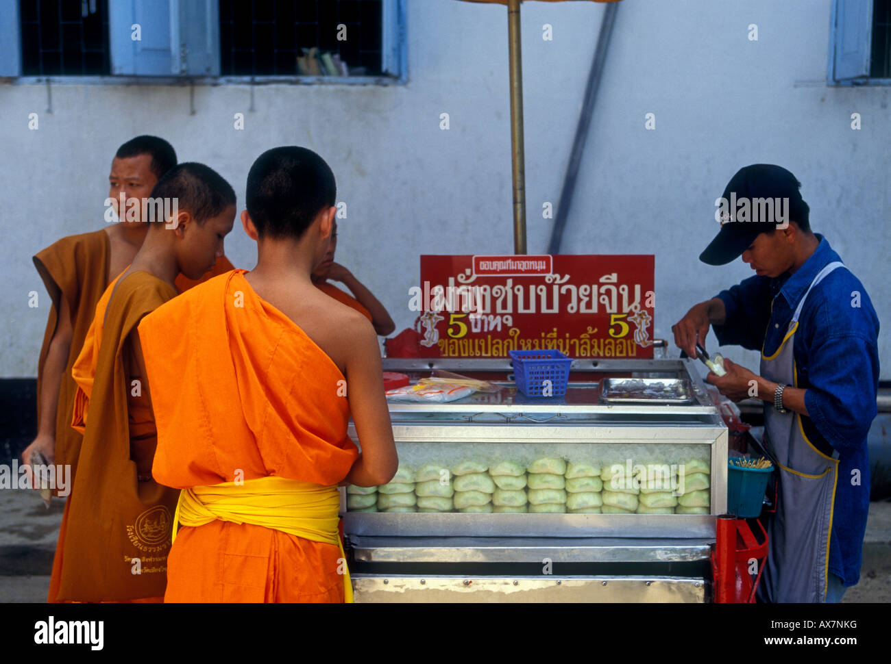 Novice monk eating hi-res stock photography and images - Alamy