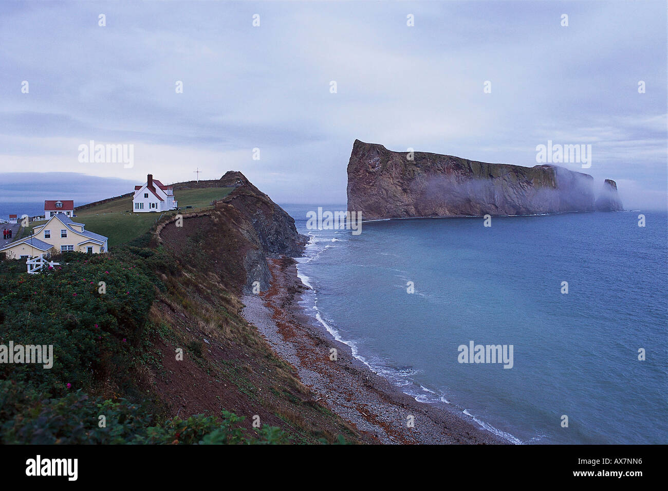 Houses at the coast under grey clouds, Perce Rock, Perce, Gaspesie ...