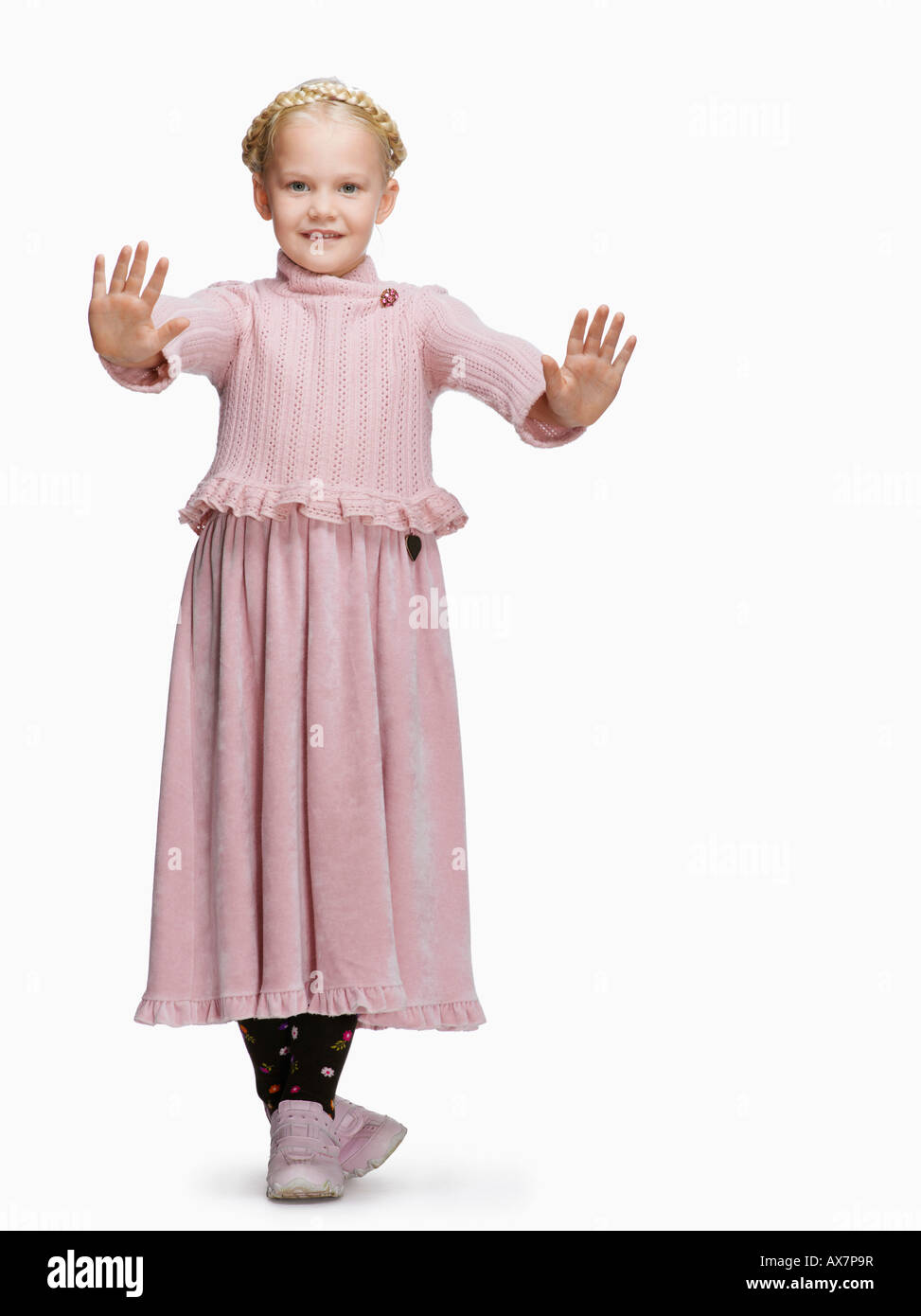 Blond girl (6-8) in a dress, gesturing, portrait Stock Photo - Alamy