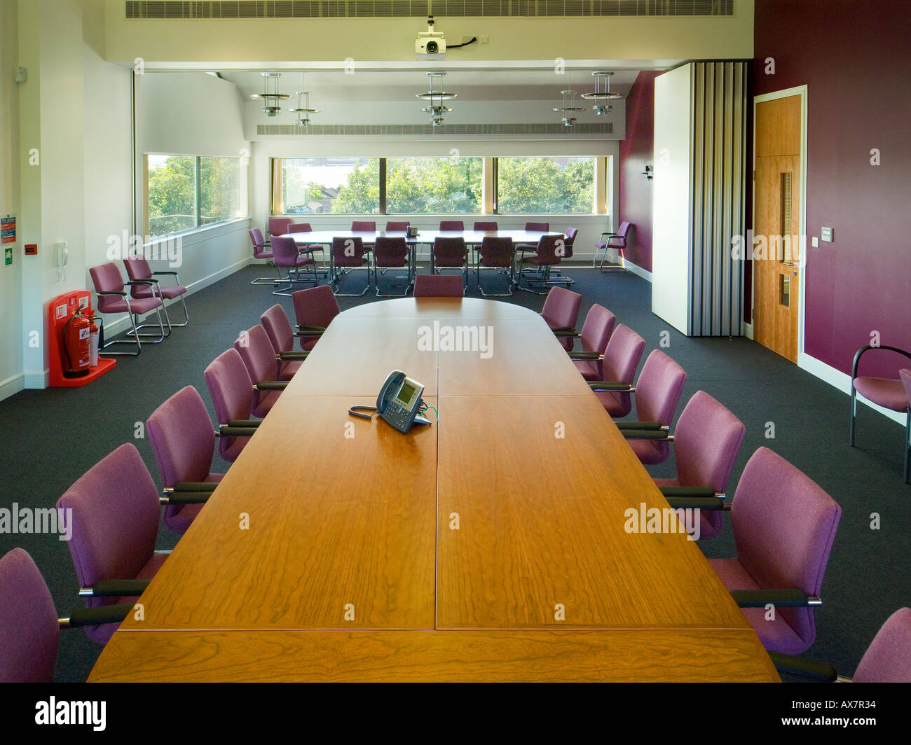 Boardroom with large office conference table Stock Photo - Alamy