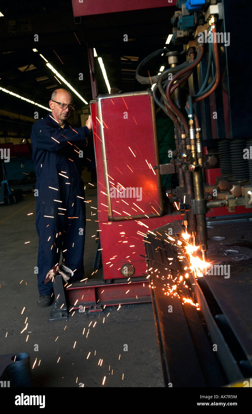 Sparks from CNC machine in an industrial workshop used by Engineer ...