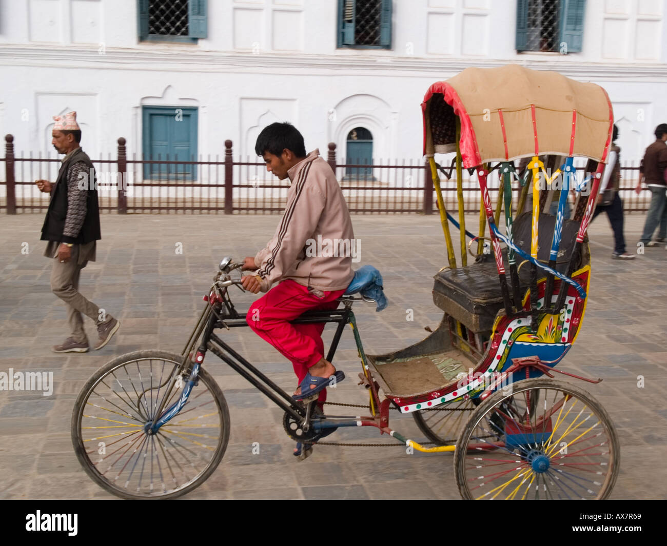 COLOURFUL RICKSHAW in BASANTPUR SQUARE with people strolling past the ...