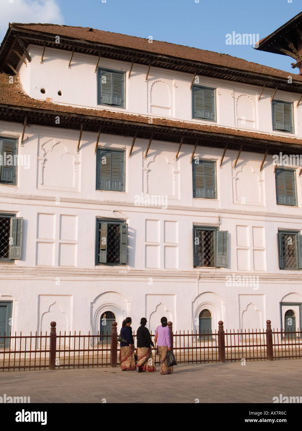 ASIAN LADIES strolling past the Old Palace complex in Basantpur Square ...