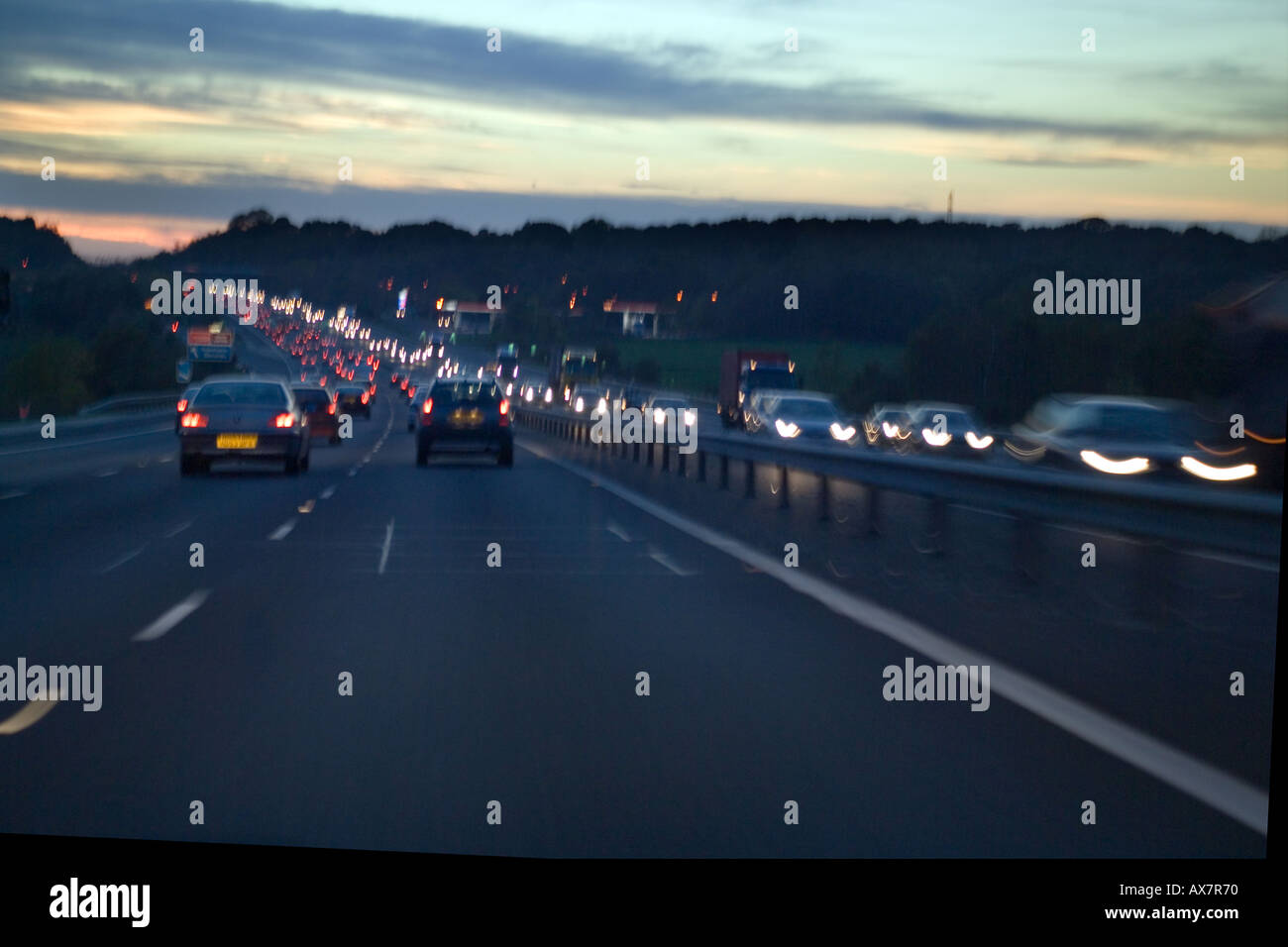 Motorway rush hour traffic at dusk Stock Photo - Alamy