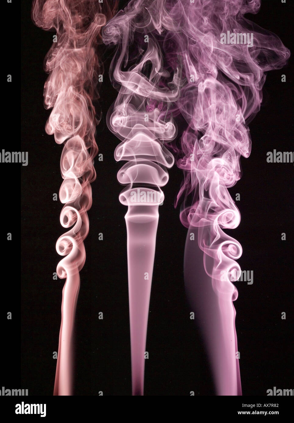 3 plumes of smoke showing natural vortex Stock Photo - Alamy