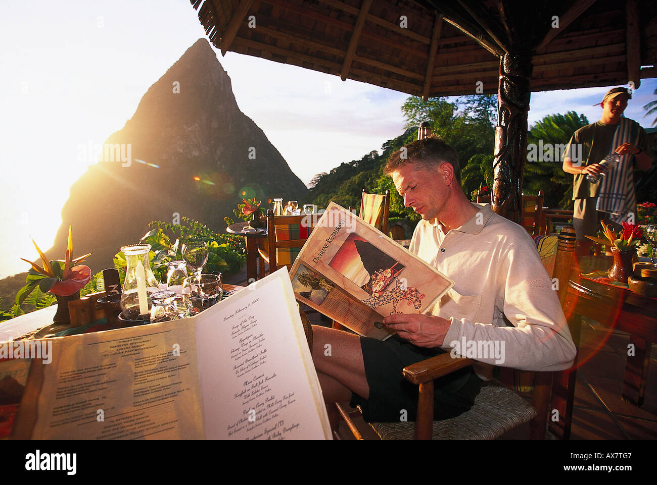 Tourist reading the menu at restaurant Dasheene at Ladera Resort, St ...