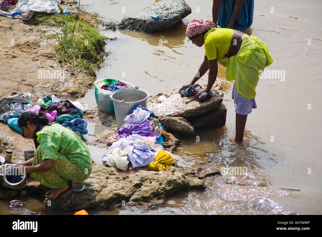 Women Washing Clothes And Pots In A River Tamil Nadu India Stock