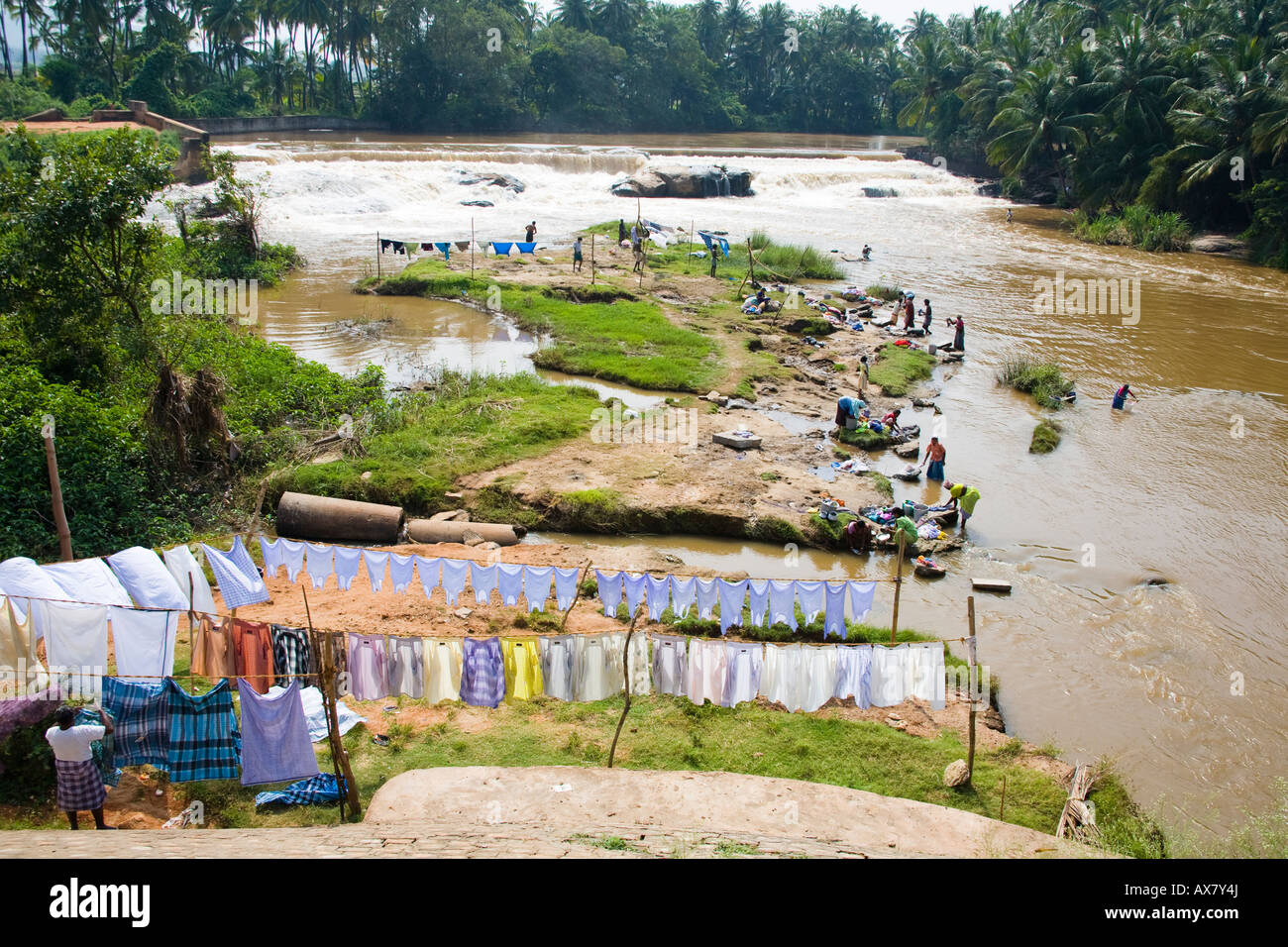 Indian women washing clothes village hi-res stock photography and ...
