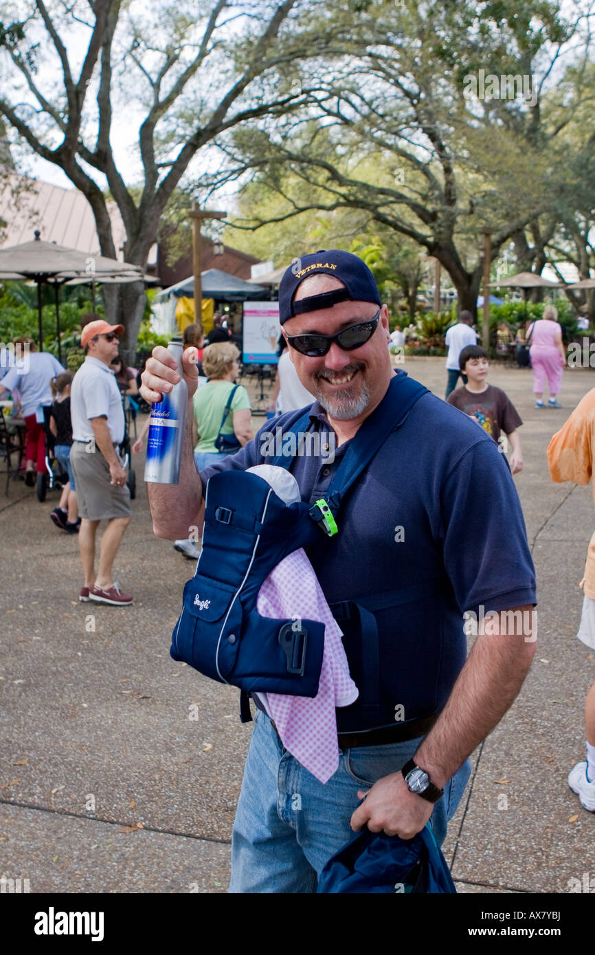 Man with Simulated Real Baby and Real Beer, Carries Fake Child for ...
