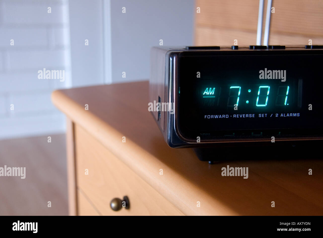 Alarm clock on night table Stock Photo - Alamy