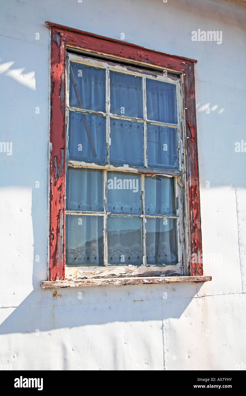 weathered multi-pane window with faded red wood frame Stock Photo - Alamy