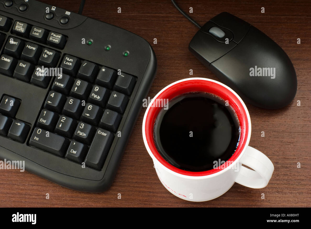 Coffe mug keyboard and mouse over talble Stock Photo - Alamy