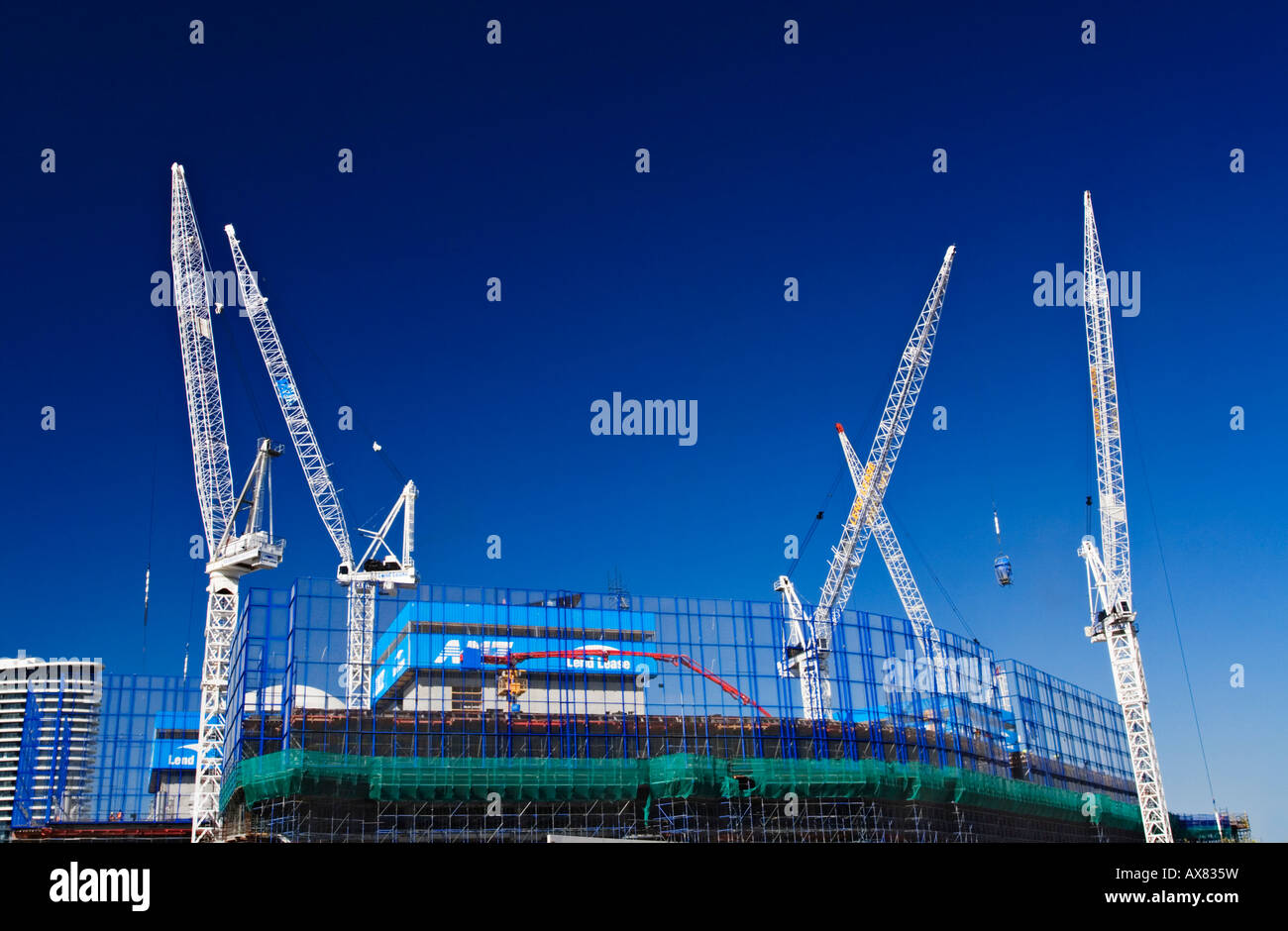 Construction Industry / Heavy cranes working overhead on a building ...