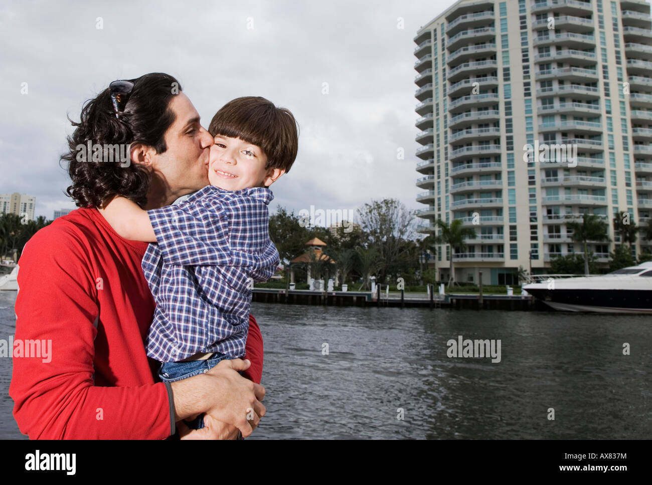 Hispanic father and son hugging outdoors Stock Photo - Alamy
