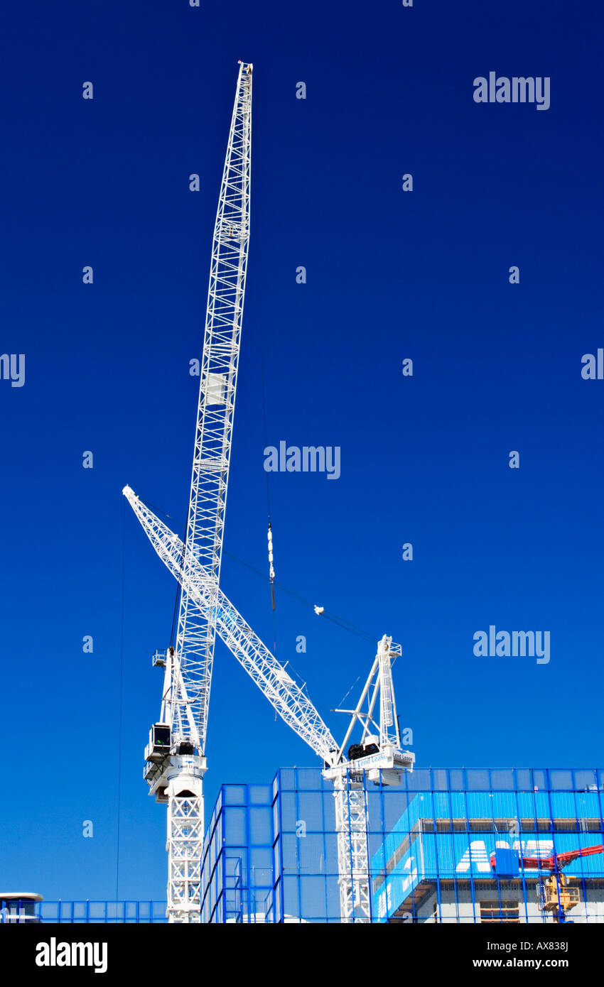 Construction Industry / Heavy cranes working overhead on a building ...