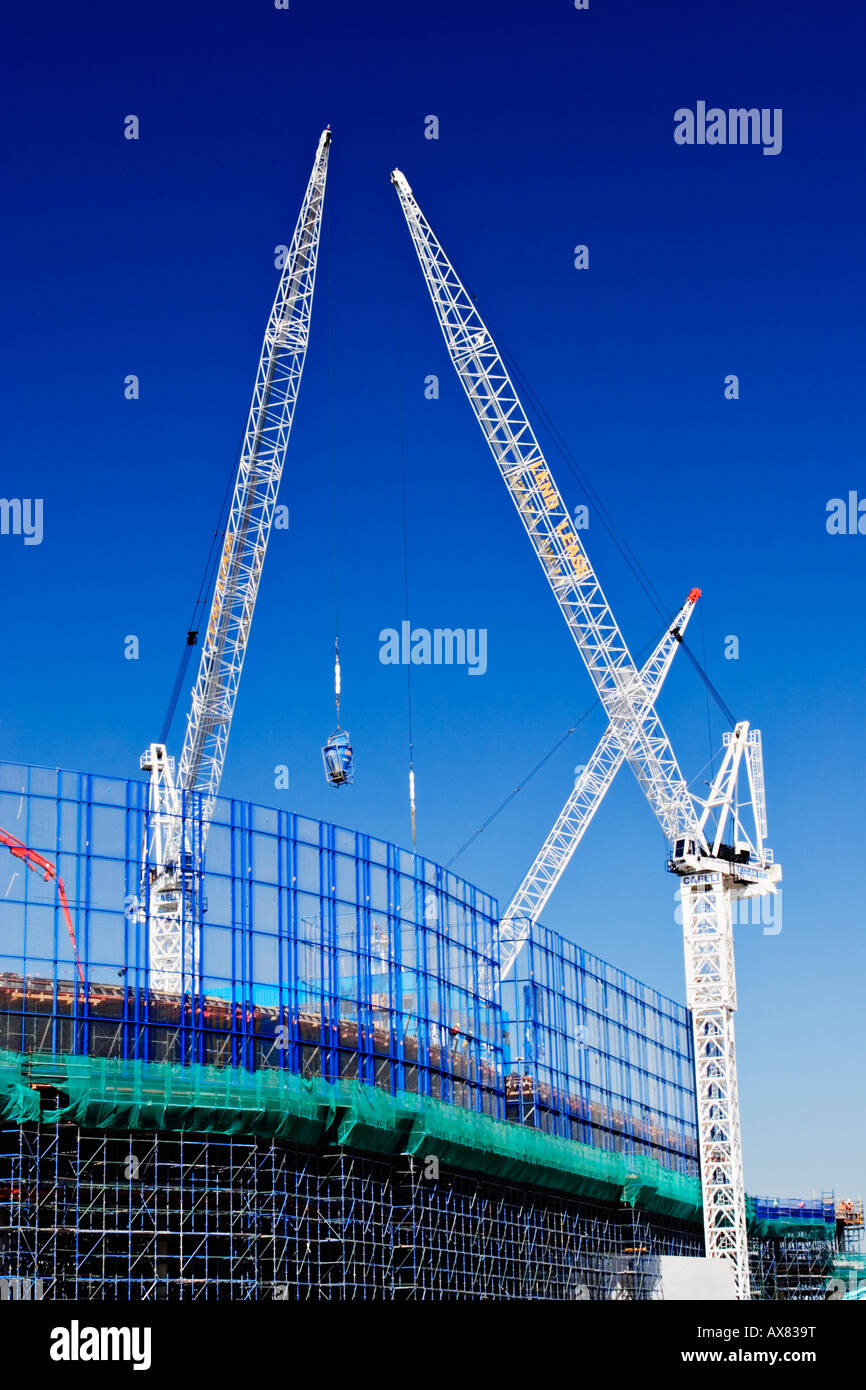 Construction Industry / Heavy Building cranes working overhead on a ...
