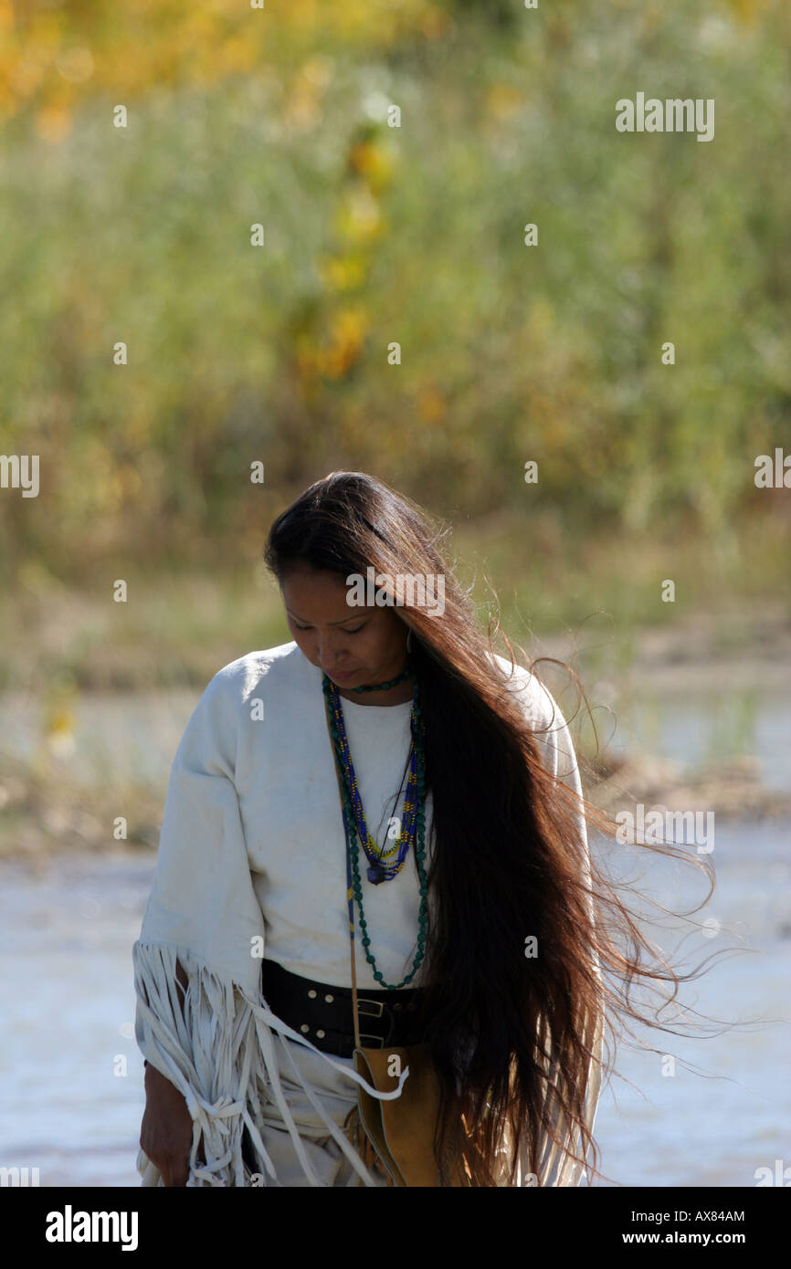 A Native American Indian women walking along the rivers edge in South ...