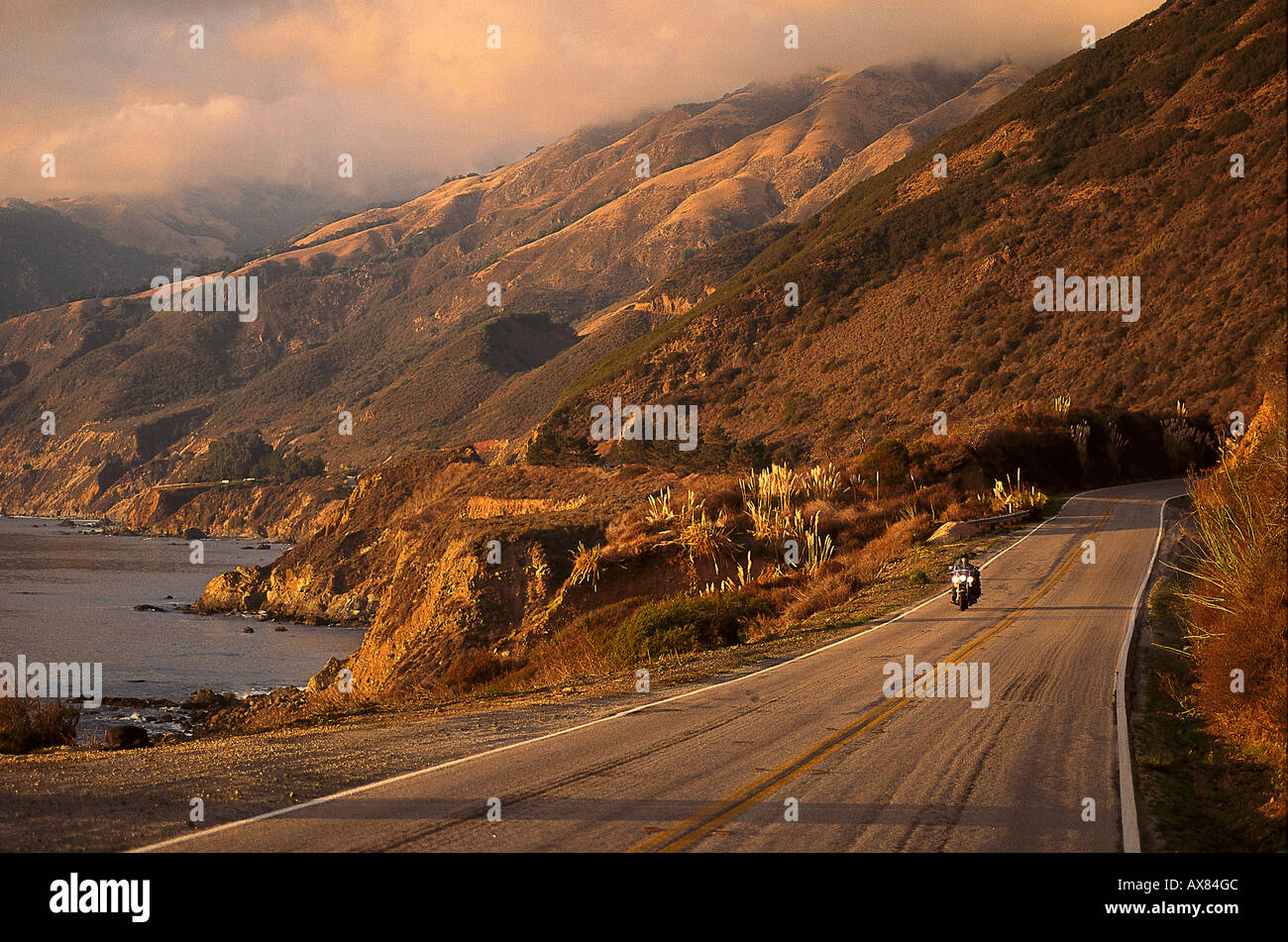 Lonesome motorbike driving on Highway 1, Cape San Martin, Lucia Range ...