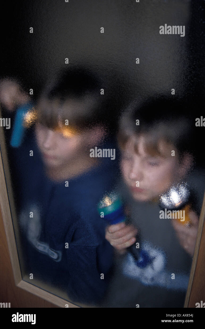 Two boys playing with flashlights in the cellar Stock Photo - Alamy