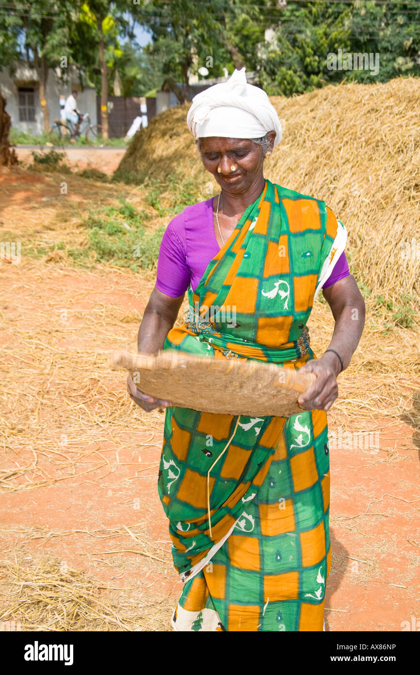 Woman sifting husks from rice, Tamil Nadu, India Stock Photo - Alamy