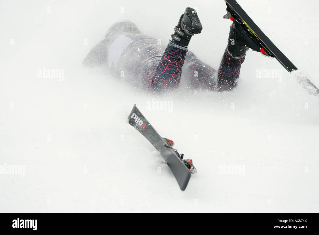 A snow skier falling and losing a ski Stock Photo - Alamy