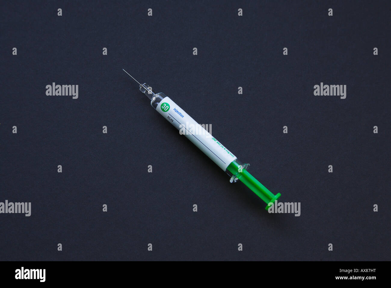 Syringe on black background Stock Photo - Alamy
