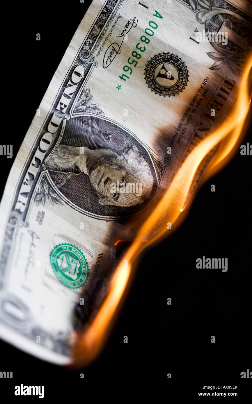 American dollar bill burning hi-res stock photography and images - Alamy
